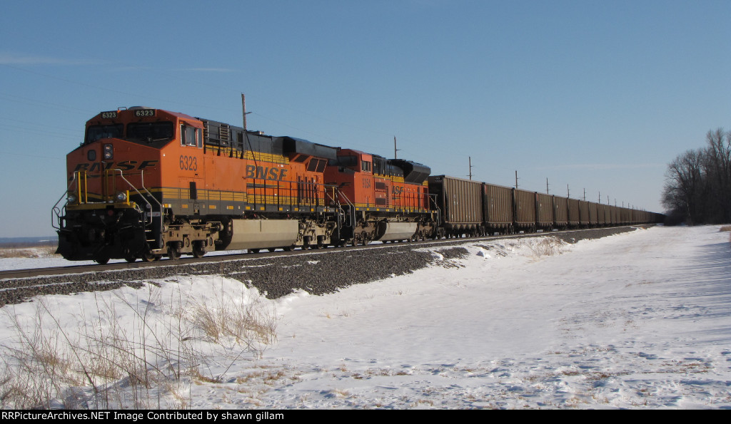 BNSF 6323 sits south of elsberry waiting for 2 southbounds.